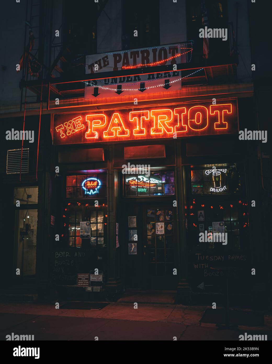 The Patriot Saloon neon sign at night, in Tribeca, Manhattan, New York ...