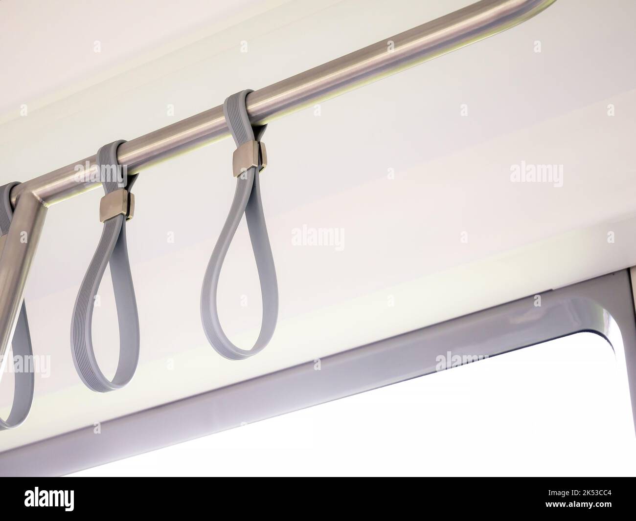 Handle bar on the bus or in a tram, public transport vehicle interior ...