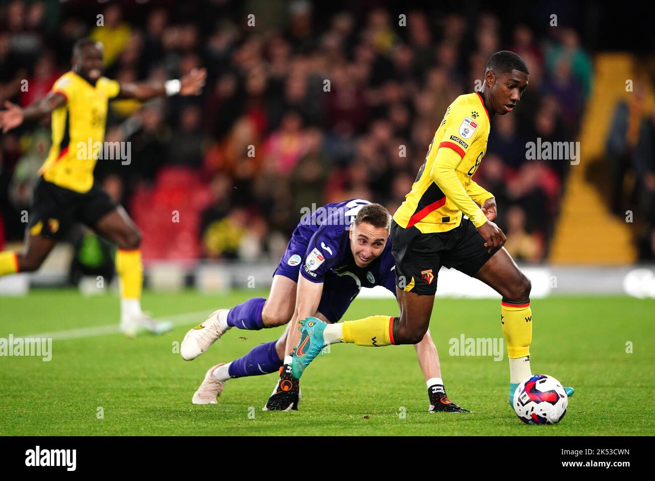 Watford's Yaser Asprilla goes around Swansea City goalkeeper Steven ...