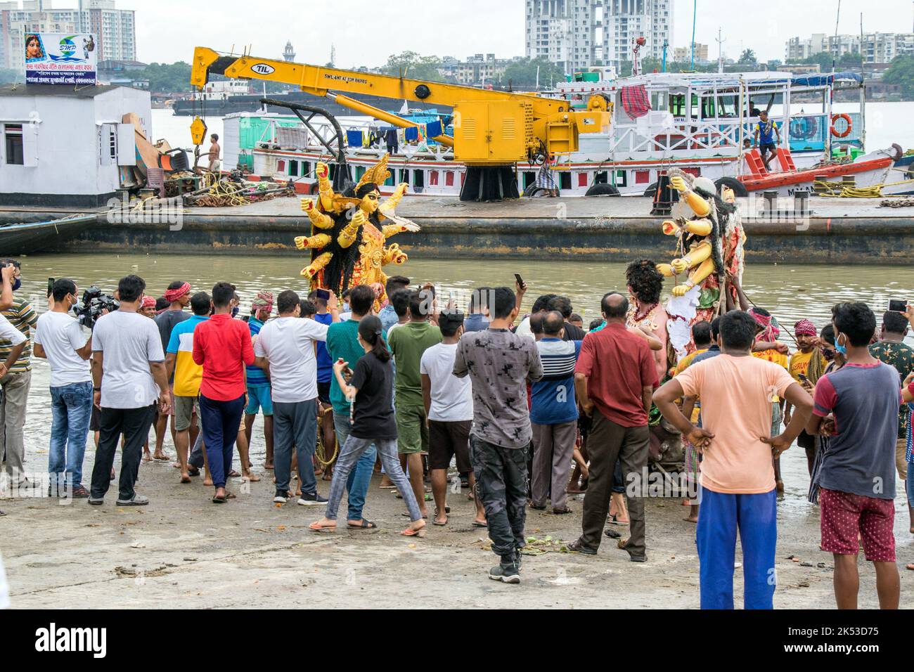 The work of immersion of Durga idol is going on at Ganga Ghat of ...