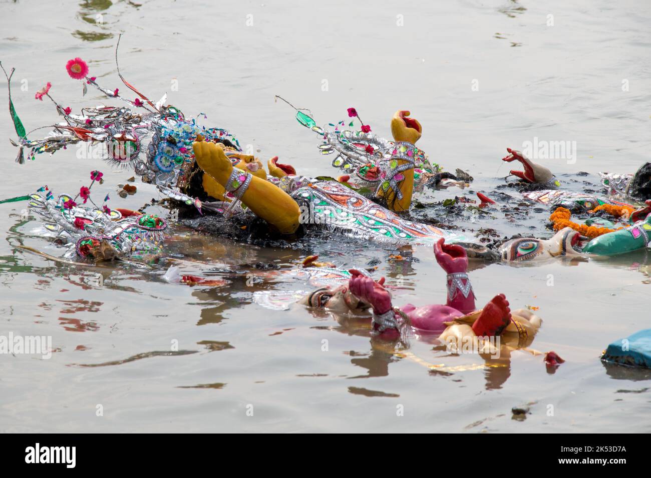 Idol of Goddess Durga is being immersed at holy river Ganges, at the ...