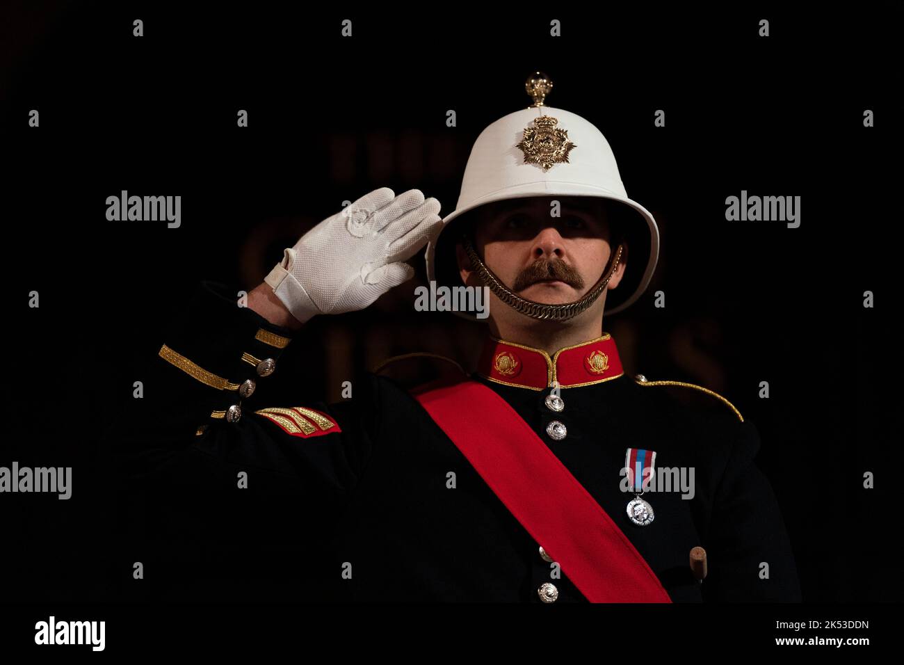 A Royal Marine as General Sir Gordon Messenger is presented with the ...