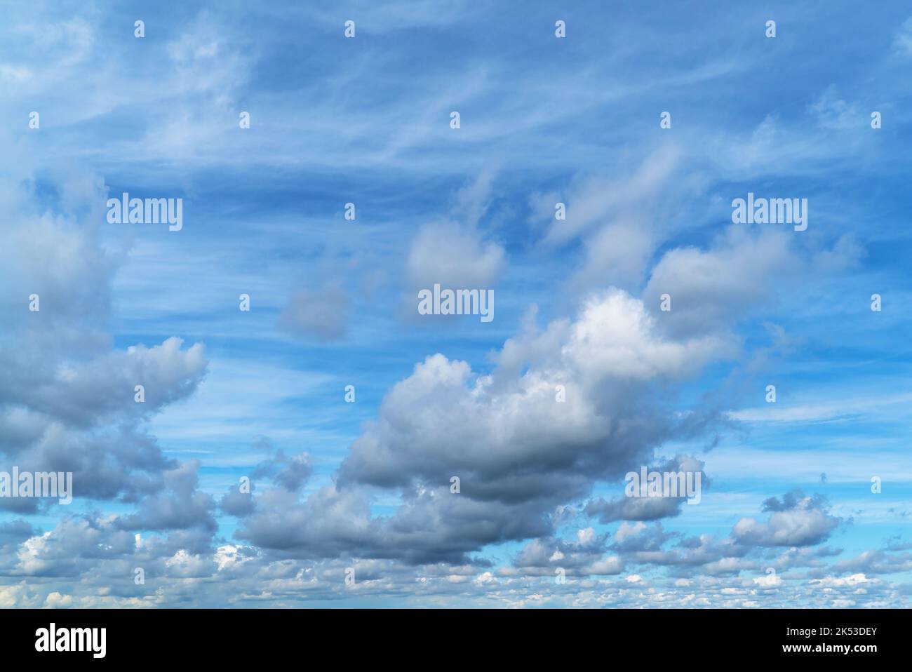 Cirrus and cumulus clouds in a blue sky Stock Photo - Alamy