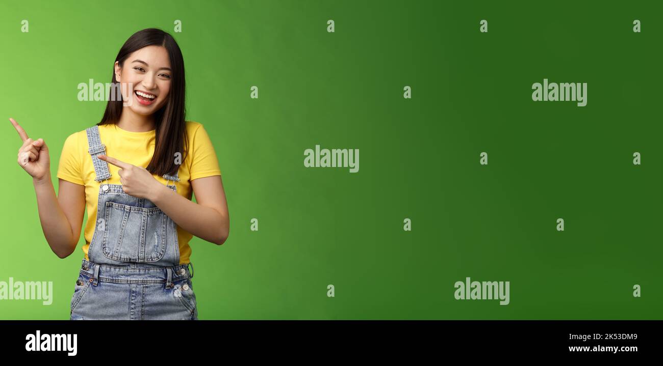 Amused friendly easygoing asian woman having fun discuss funny comedy ...