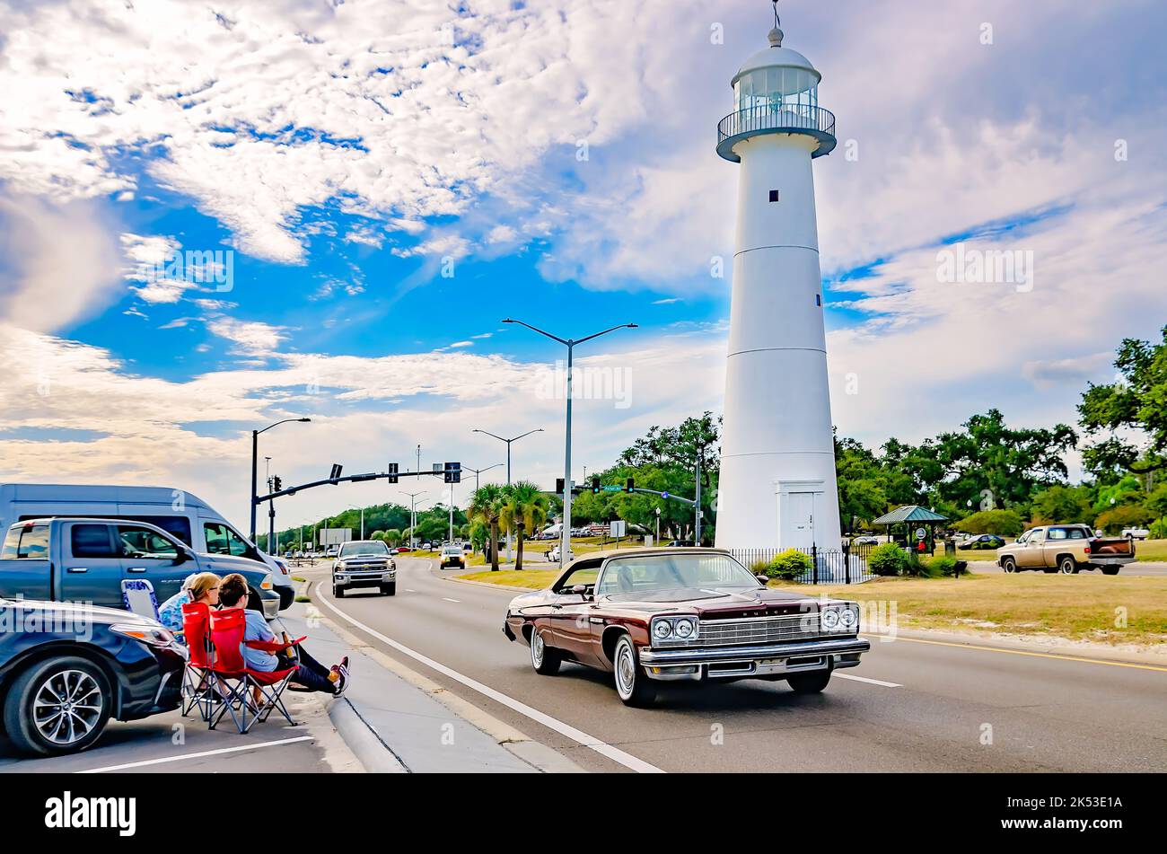 A vintage automobile passes the Biloxi lighthouse during the 26th ...