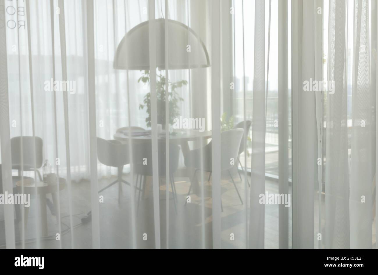 cafe table and chairs behind white transparent curtains Stock Photo - Alamy