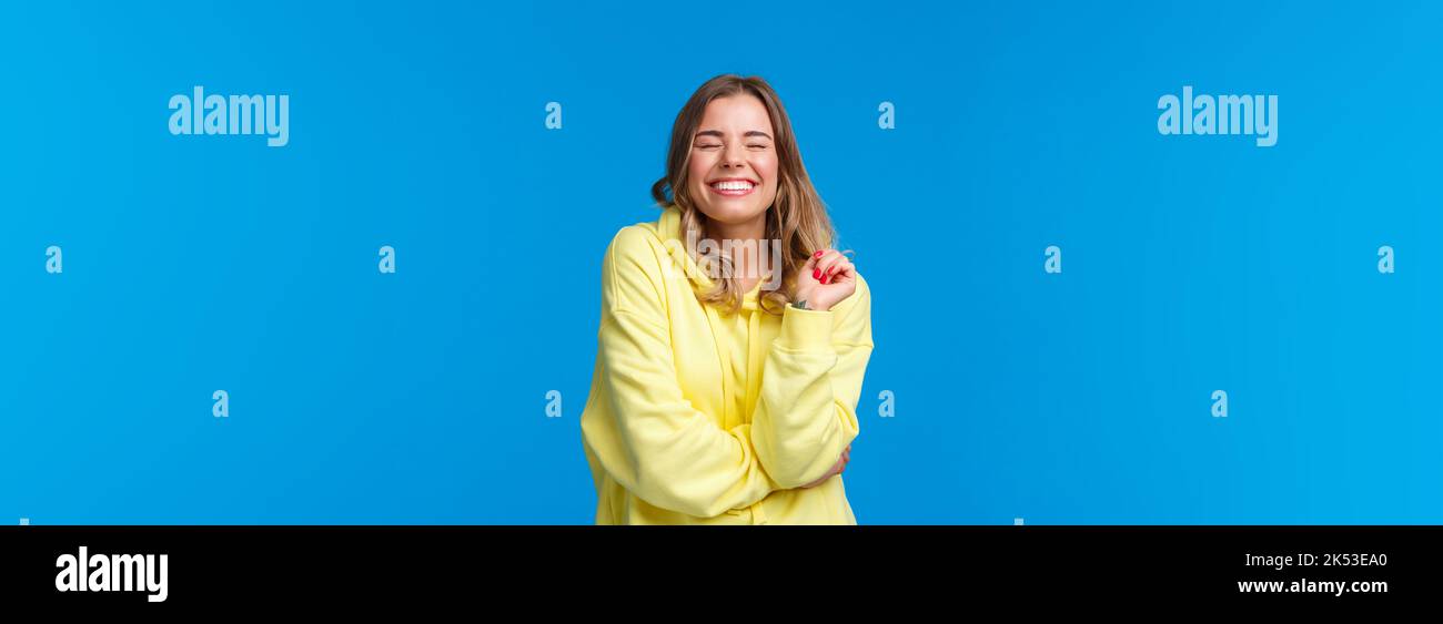Cheerful carefree pleased girl feel happy and delighted, close eyes ...