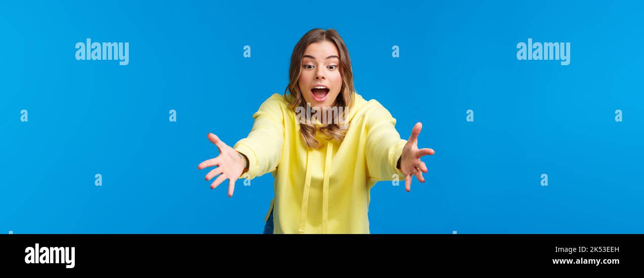 Girl trying to catch somthing, look focused and amused playing with ...