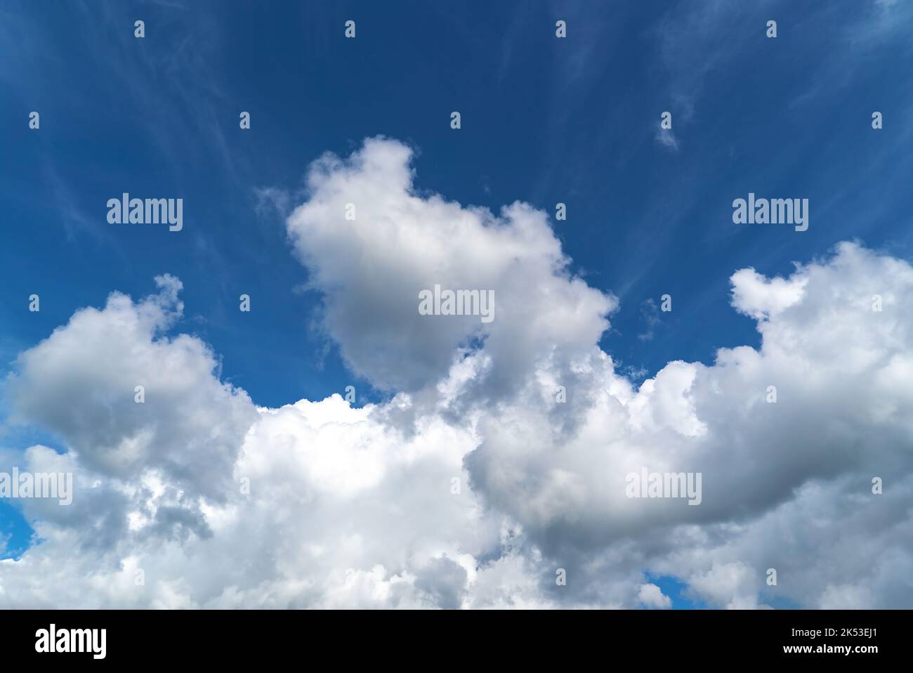 Cirrus and cumulus clouds in a blue sky Stock Photo - Alamy