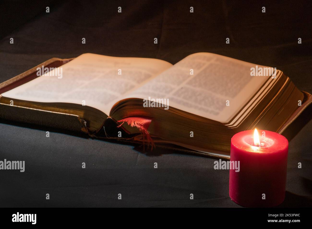 Open bible and candle hi-res stock photography and images - Alamy