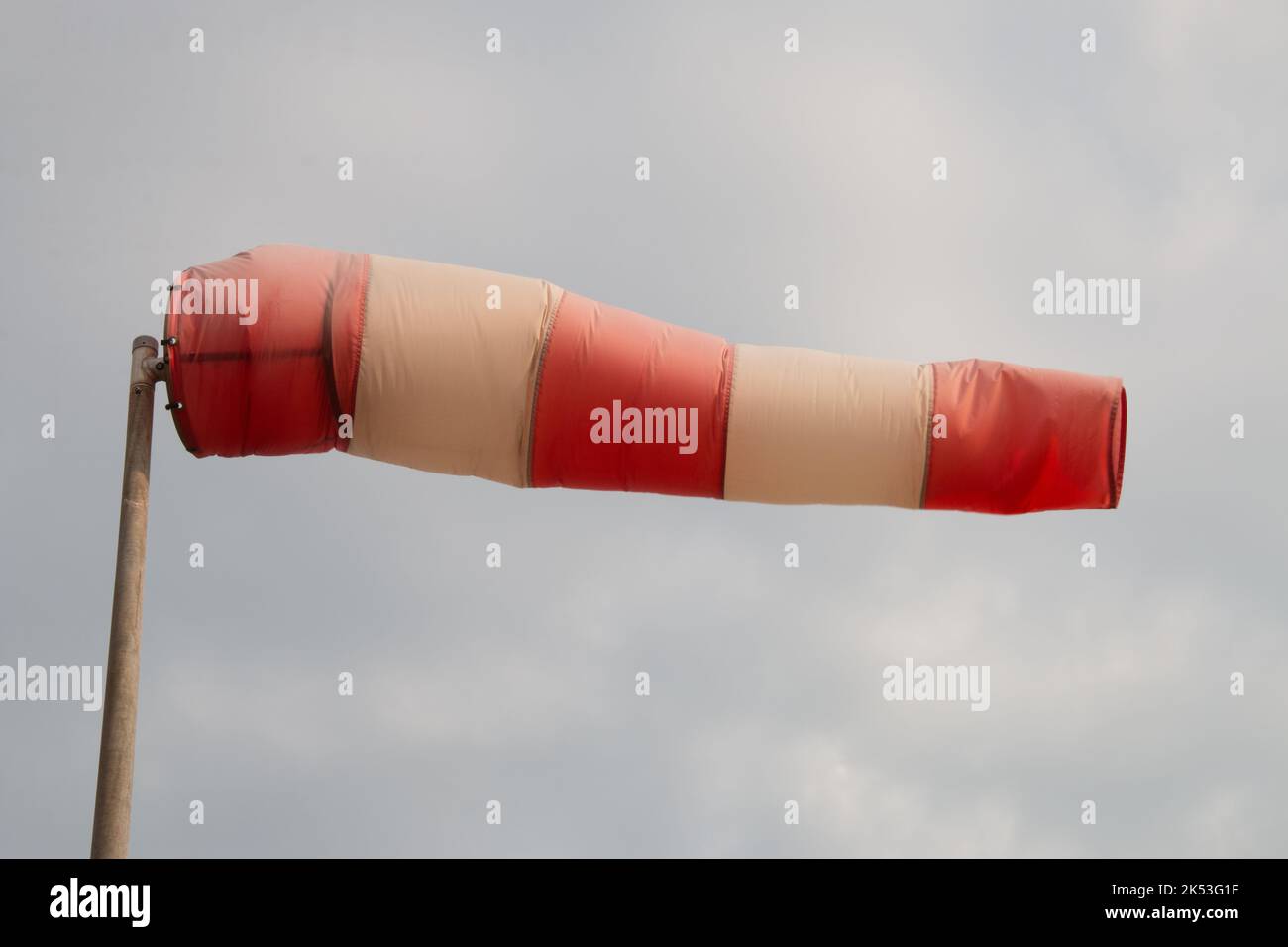 Windsock blowing horizontal on a windy day. Netherlands Stock Photo - Alamy