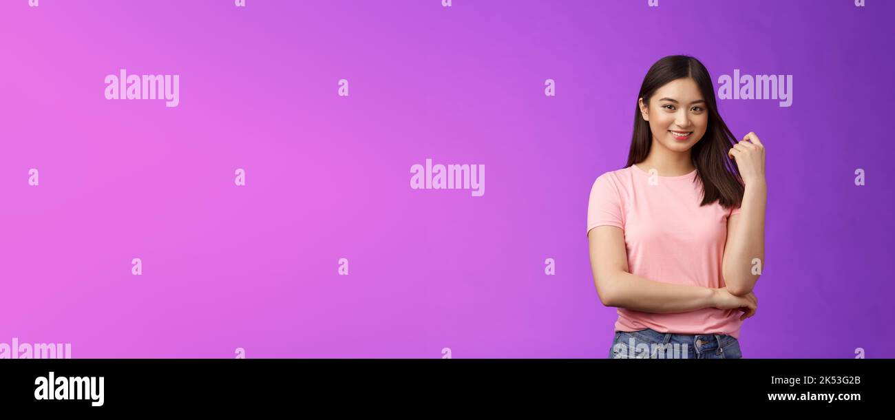 Friendly attractive stylish woman asian playing hair stran, touching ...