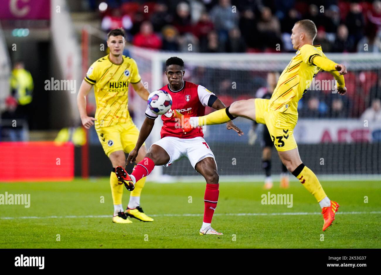 Rotherham United's Chiedozie Ogbene (left) and Millwall's George ...