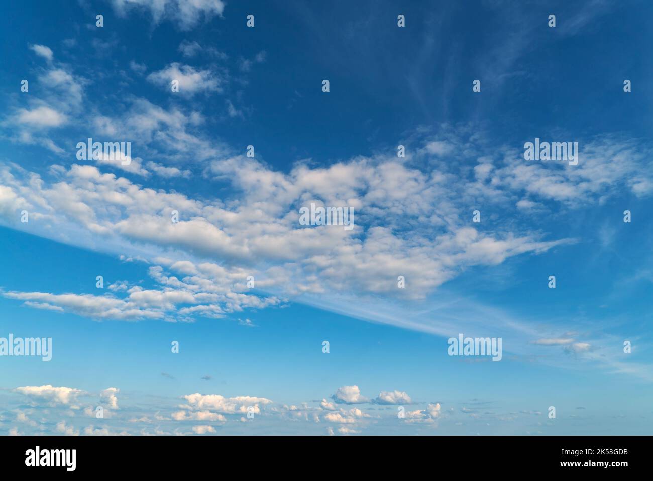 Cirrus and cumulus clouds in a blue sky Stock Photo - Alamy