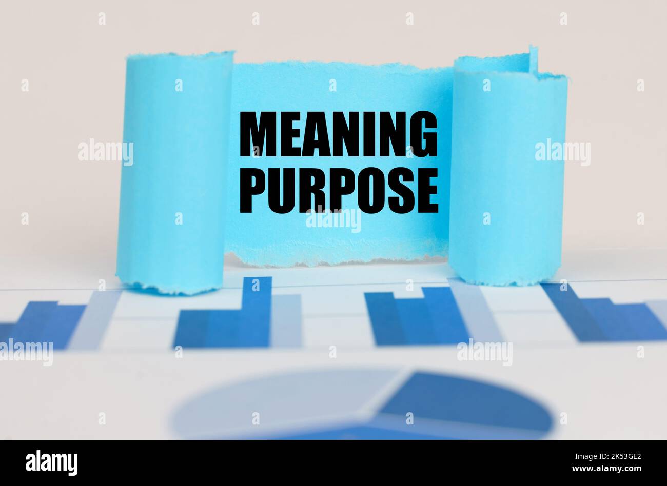 Business concept. On the blue diagram and graphs there is a twisted ...