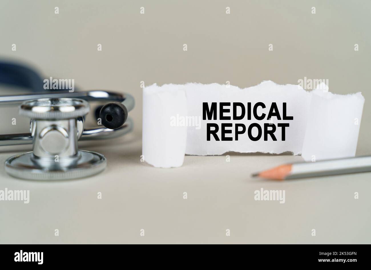 Medical concept. On a gray background, a stethoscope, a pencil and a ...