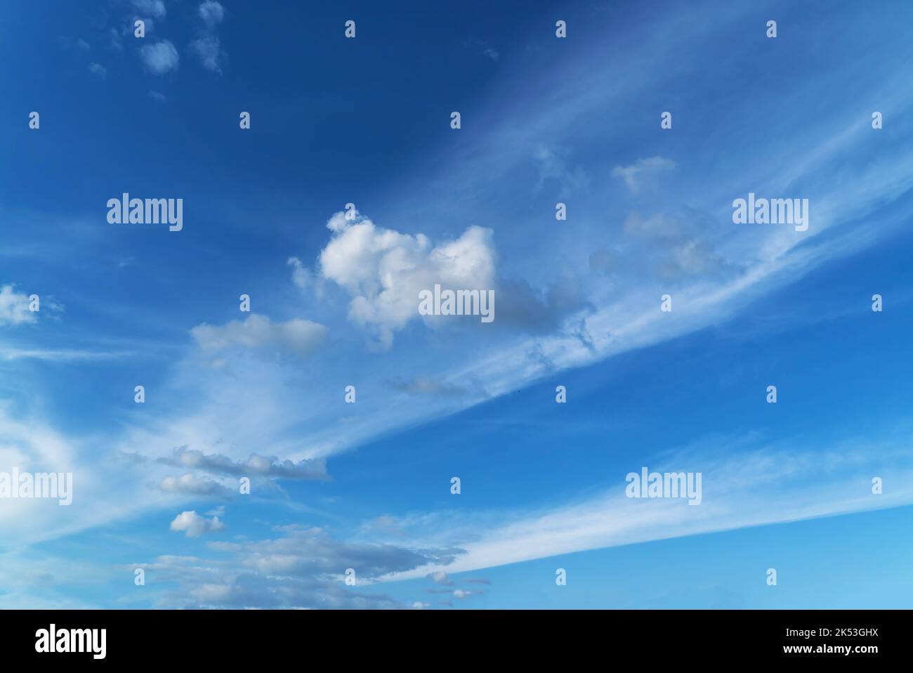 Cirrus and cumulus clouds in a blue sky Stock Photo - Alamy