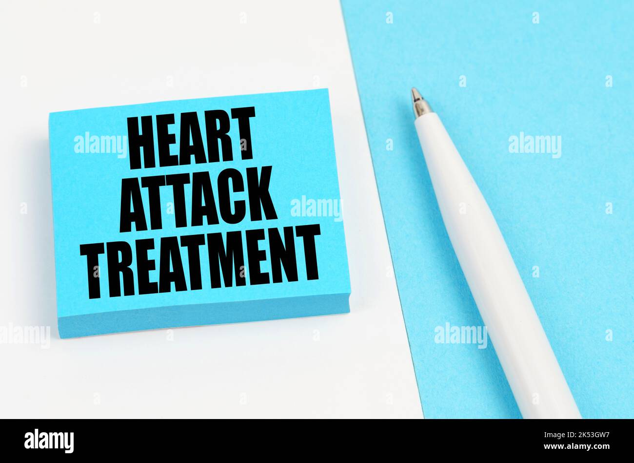 Medical concept. On a white and blue surface, a pen and blue stickers ...