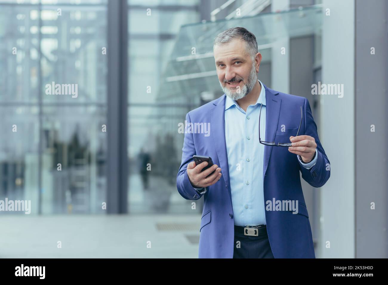 Portrait senior handsome gray-haired male teacher, professor, lecturer ...