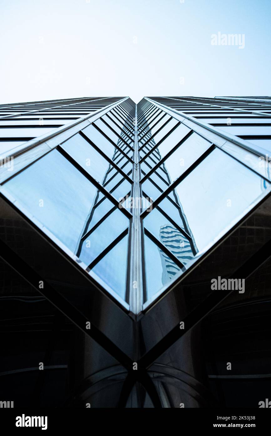 A vertical low-angle shot of modern symmetrical buildings Stock Photo ...