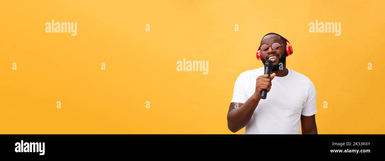 young handsome african american boy singing emotional with micro Stock ...