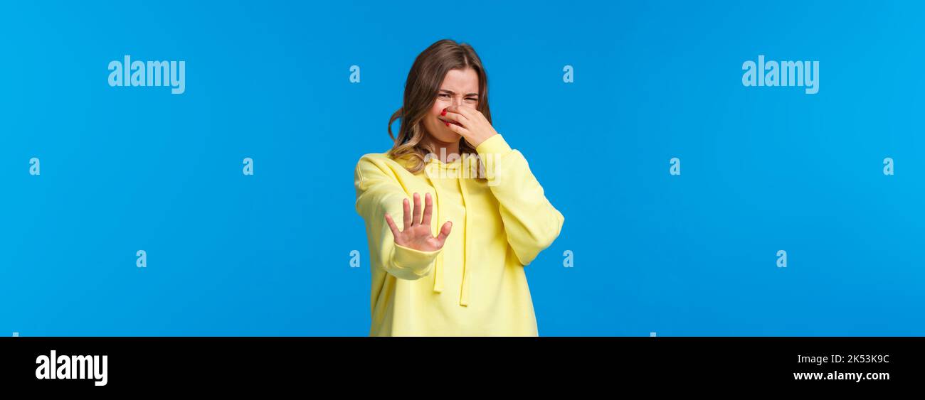 Oh gosh take this away from my face. Bothered and disturbed young blond ...