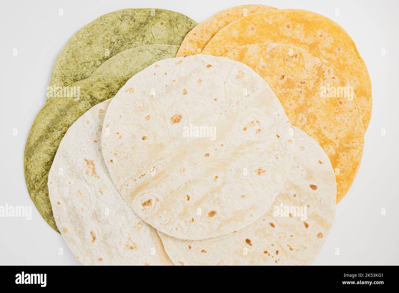 Tomato, spinach flavored and plain wheat tortilla wraps. Spanish or ...