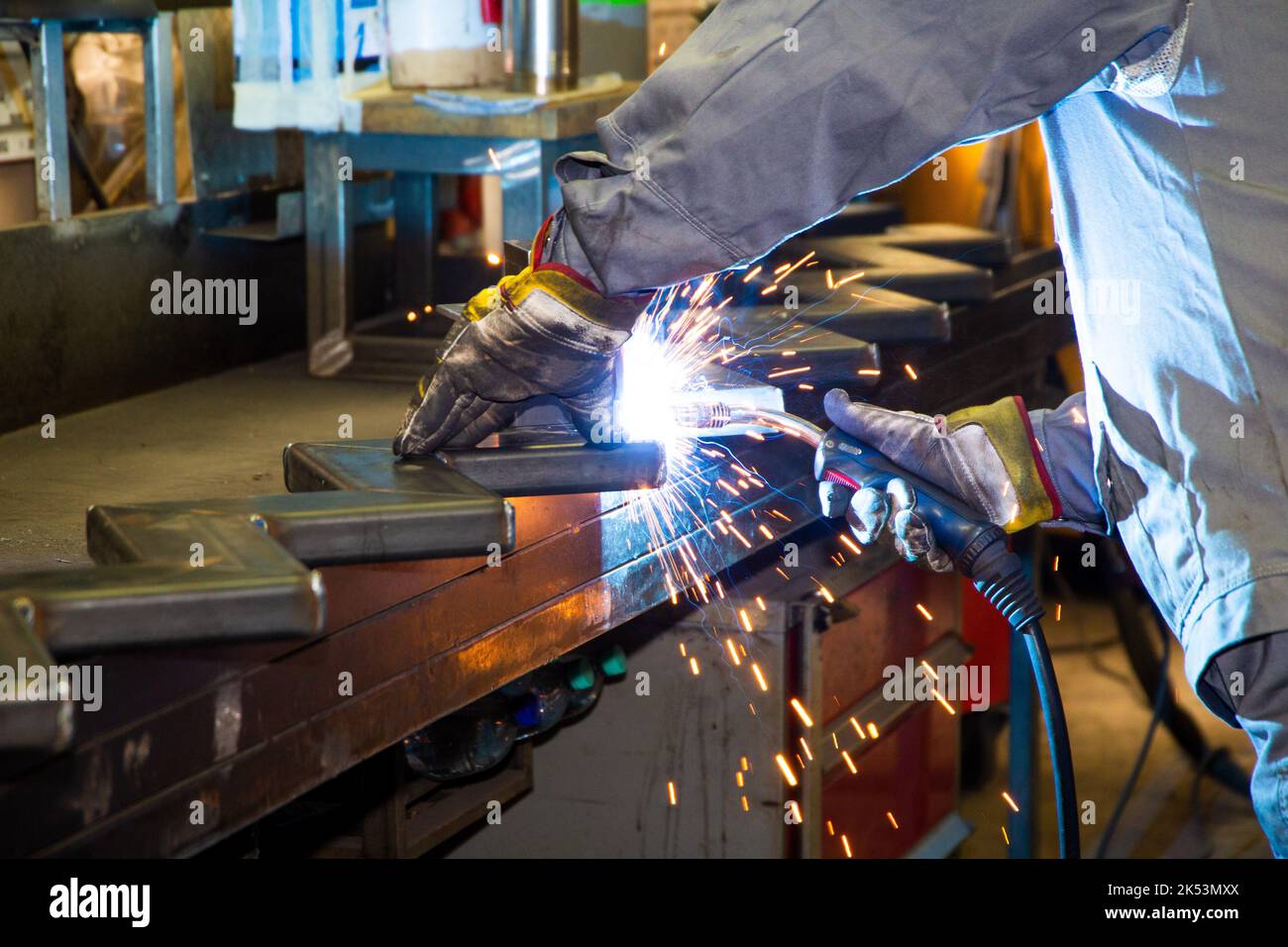 Locksmith doing welding work Stock Photo - Alamy