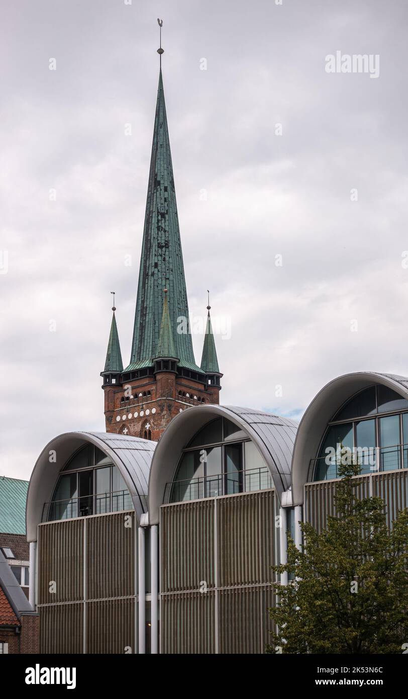 Germany, Lubeck - July 13, 2022: Closeup, Green spire on brown brick ...