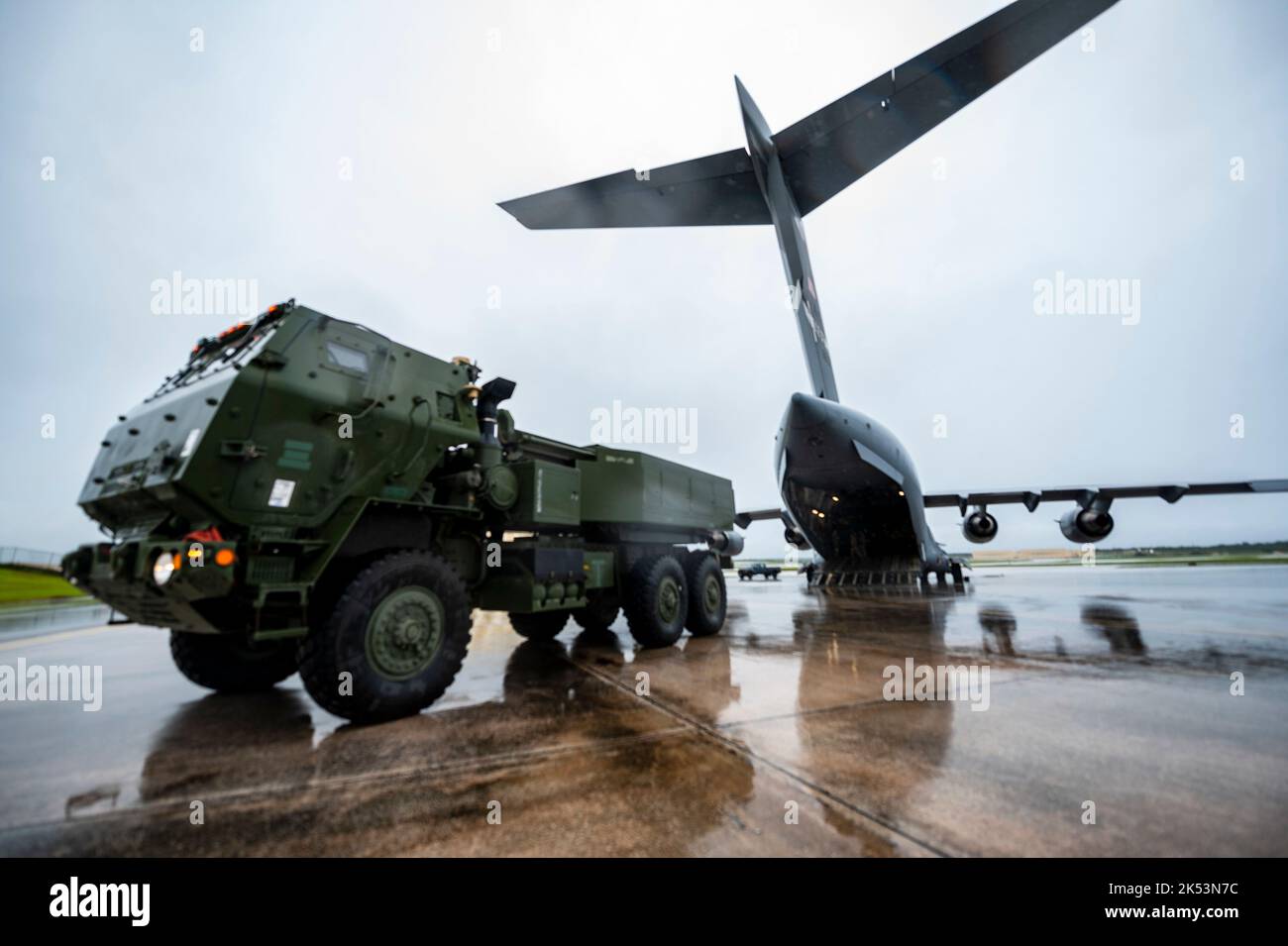 U.S. Soldiers prepare to load a M142 High Mobility Arillery Rocket ...