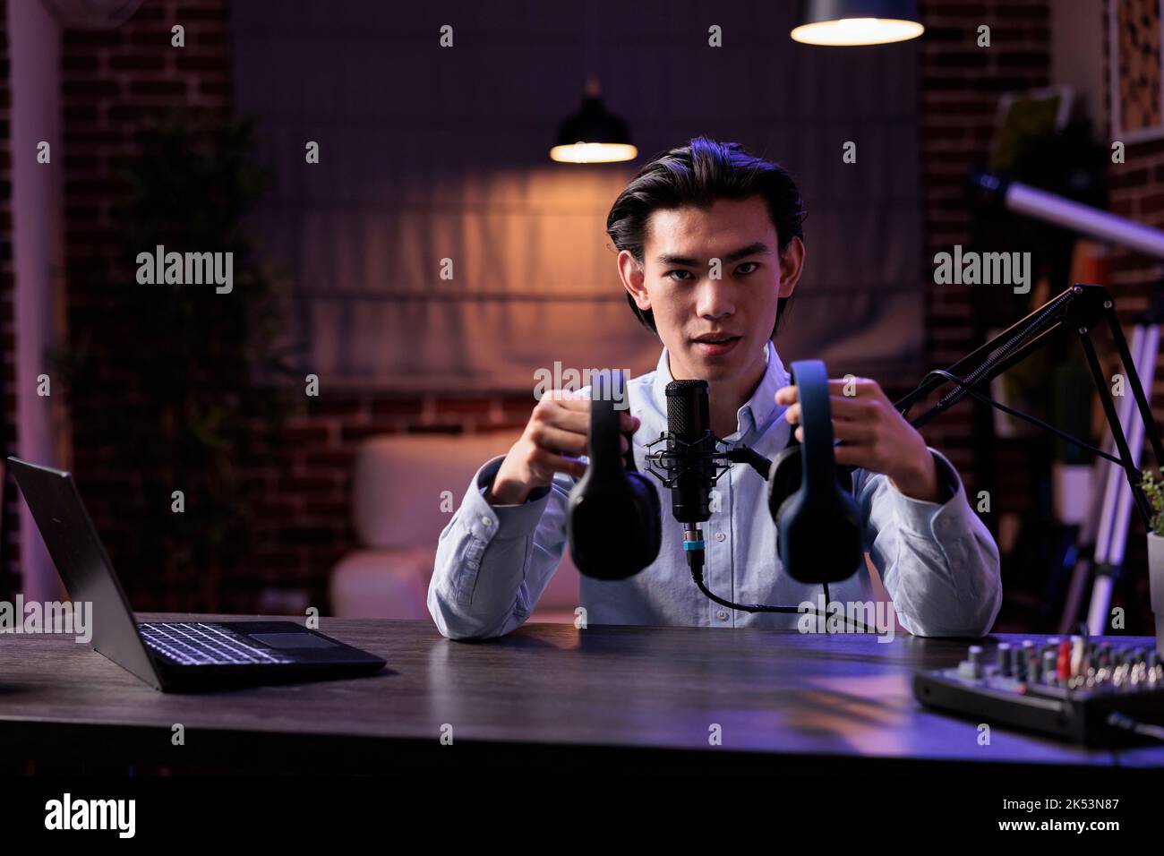 Asian vlogger filming product review recommendation, recording podcast ...