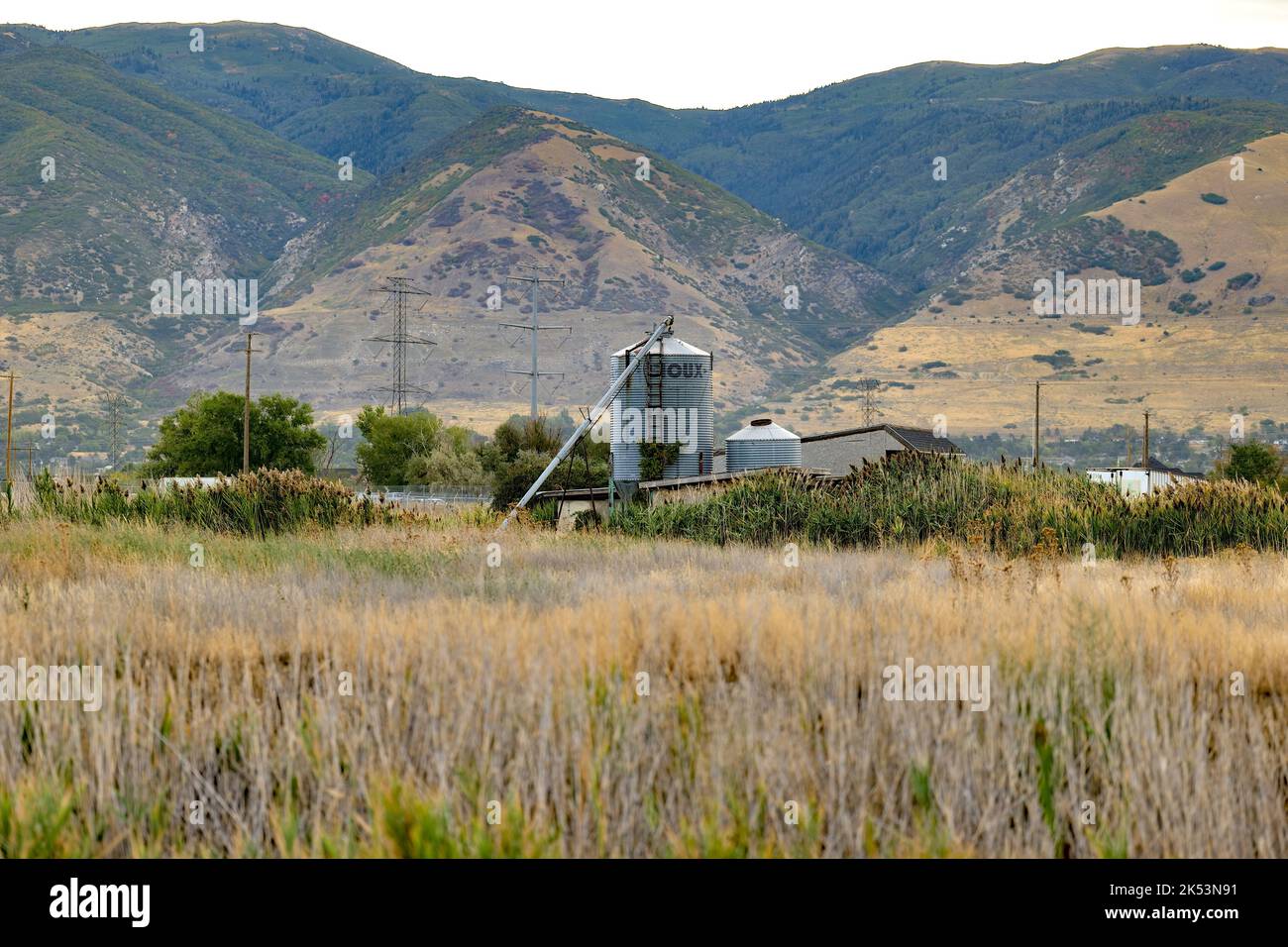 The view of an Old Silo in and trees before the mountain slopes in the ...