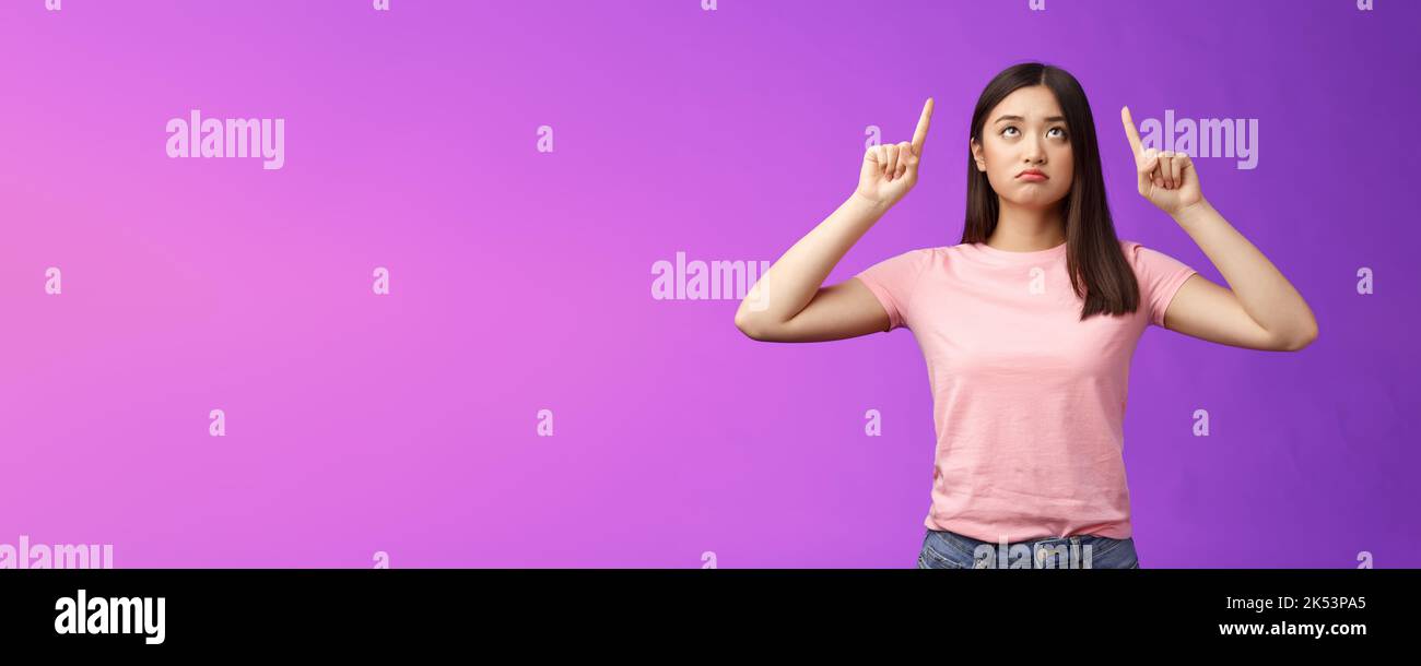 Sad disappointed sulking asian girl with short dark haircut, look ...