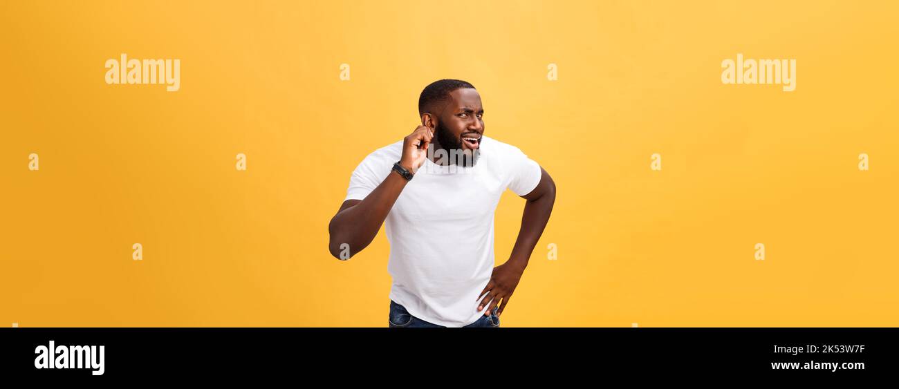 Headshot of goofy surprised bug-eyed young dark-skinned man student ...