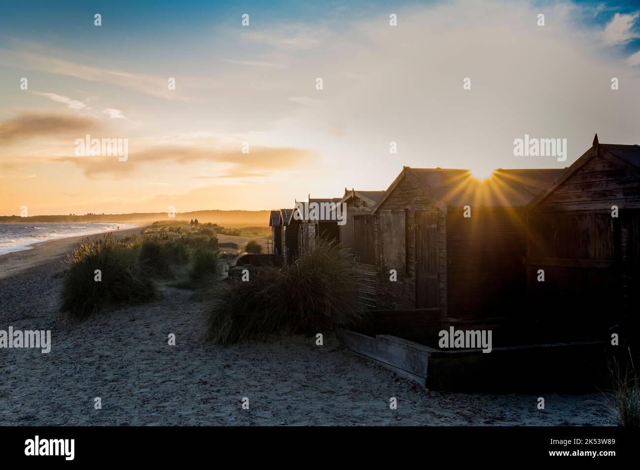 Walberswick, Suffolk, iconic beach huts at sunset at a popular East ...