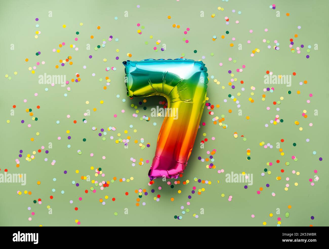 Colorful balloon number 7 on light green background. New Year of ...