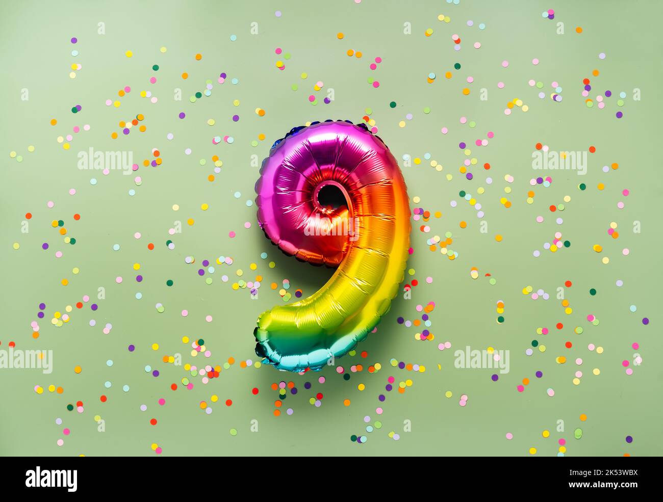 Colorful balloon number 9 on light green background. New Year of ...