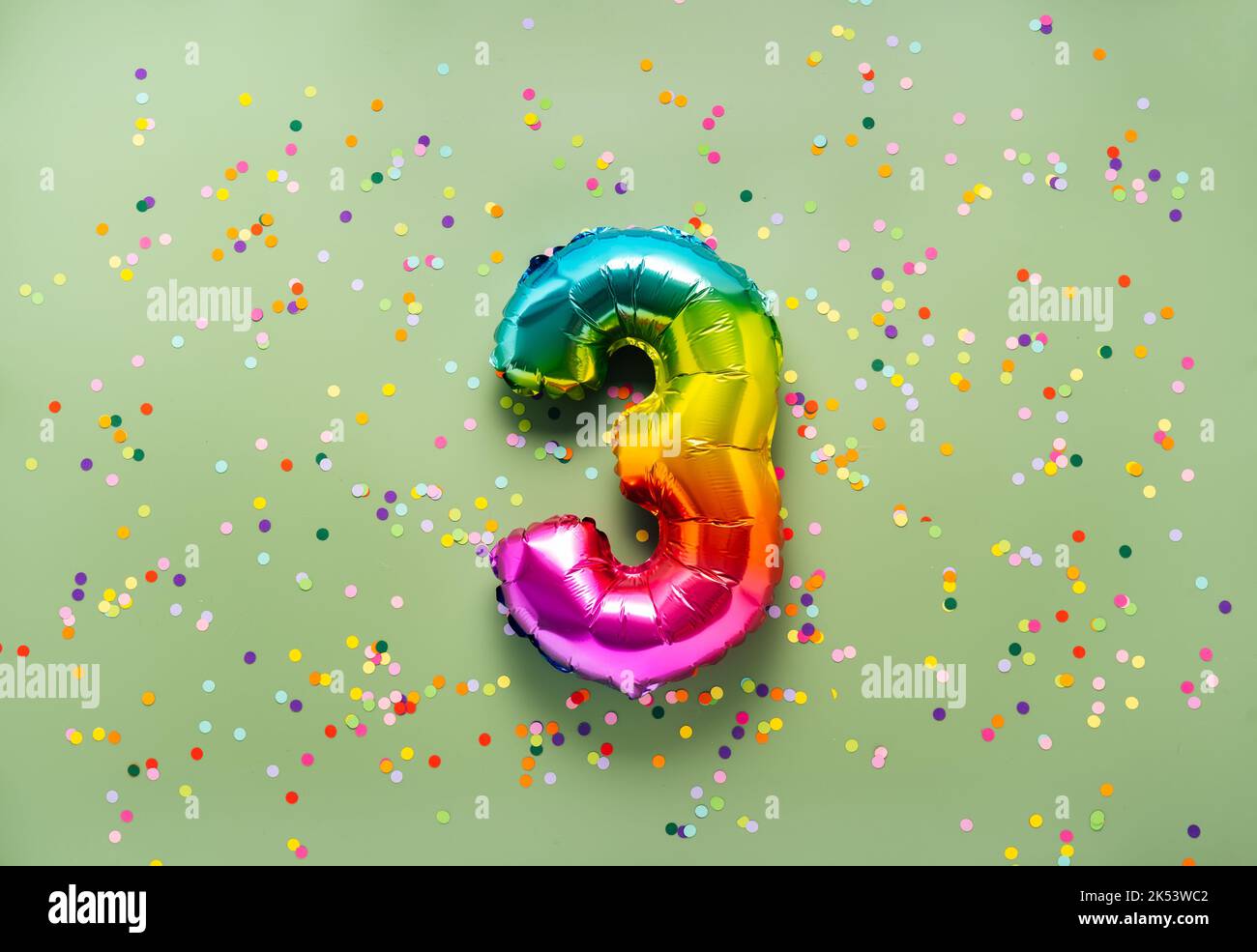 Colorful balloon number 3 on light green background. New Year of ...