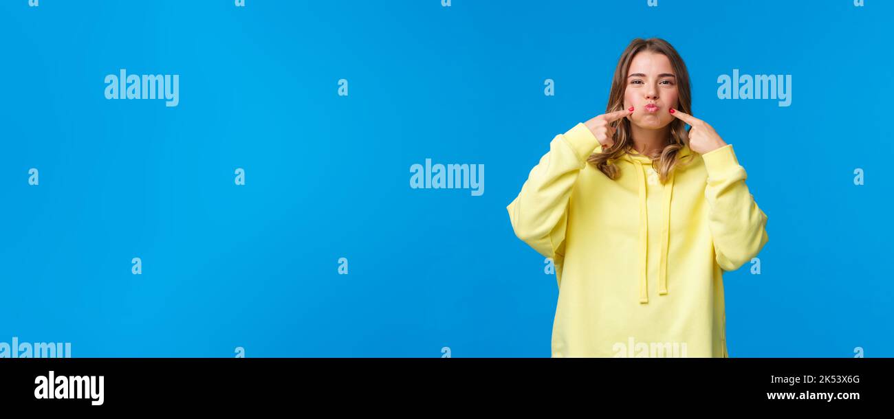 Women, lifestyle and emotions concept. Portrait of silly carefree girl ...