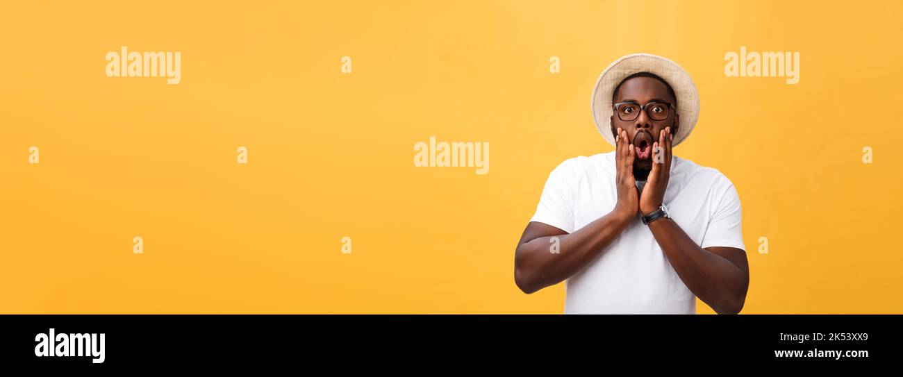 Headshot of goofy surprised bug-eyed young dark-skinned man student ...