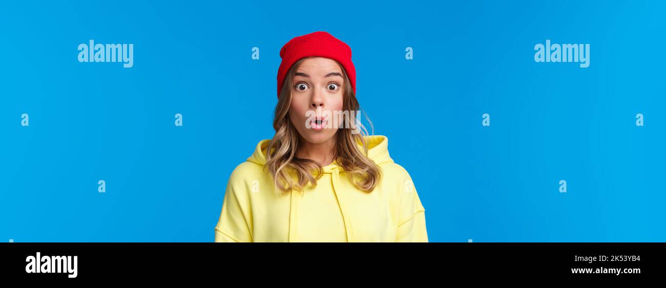 Wow tell me more. Intrigued and curious blond european girl staring ...