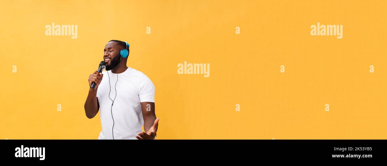 Portrait of cheerful positive chic handsome african man holding ...