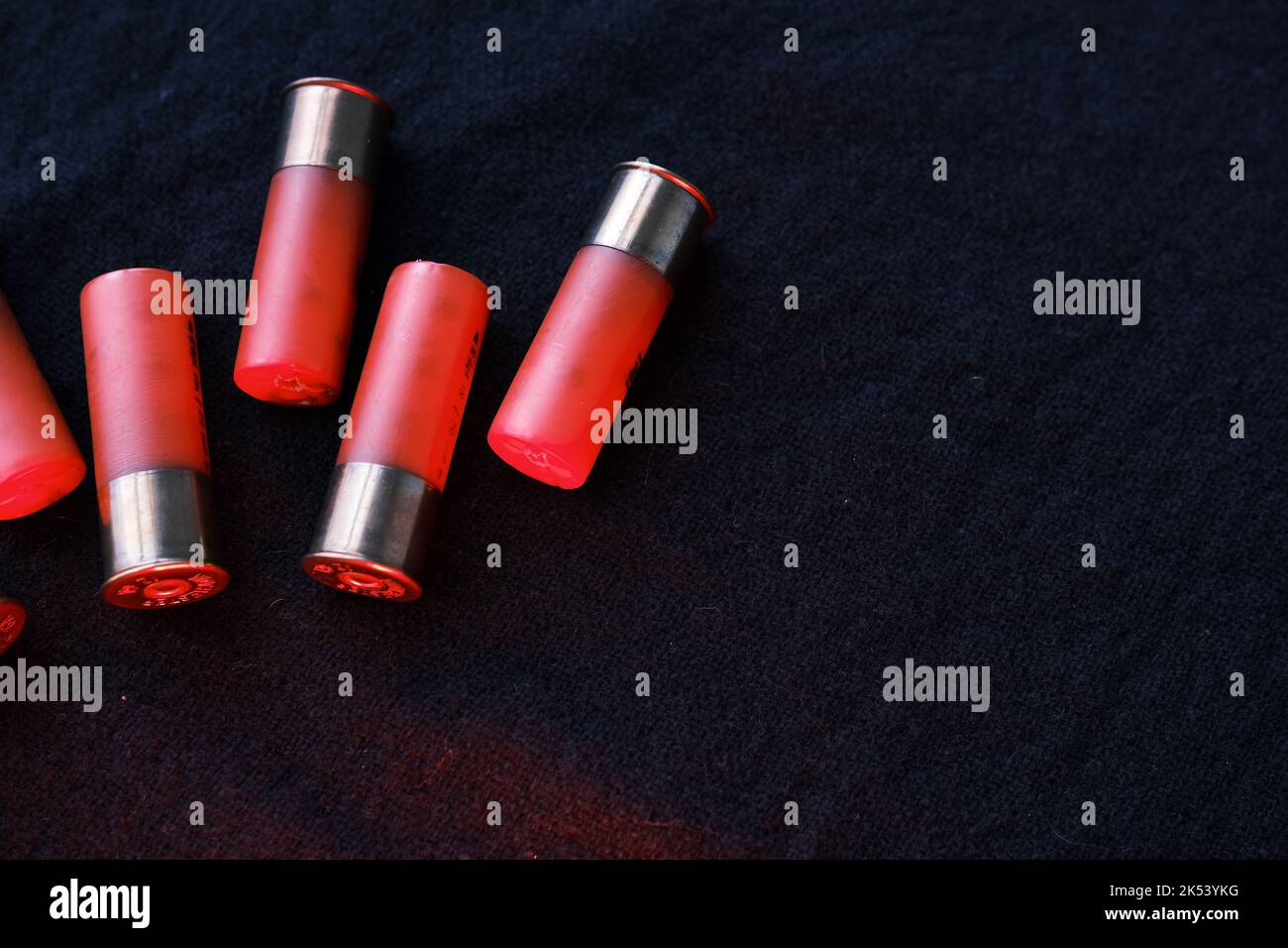 Shotgun shells on a black surface. Ammunition for 12 gauge smoothbore ...