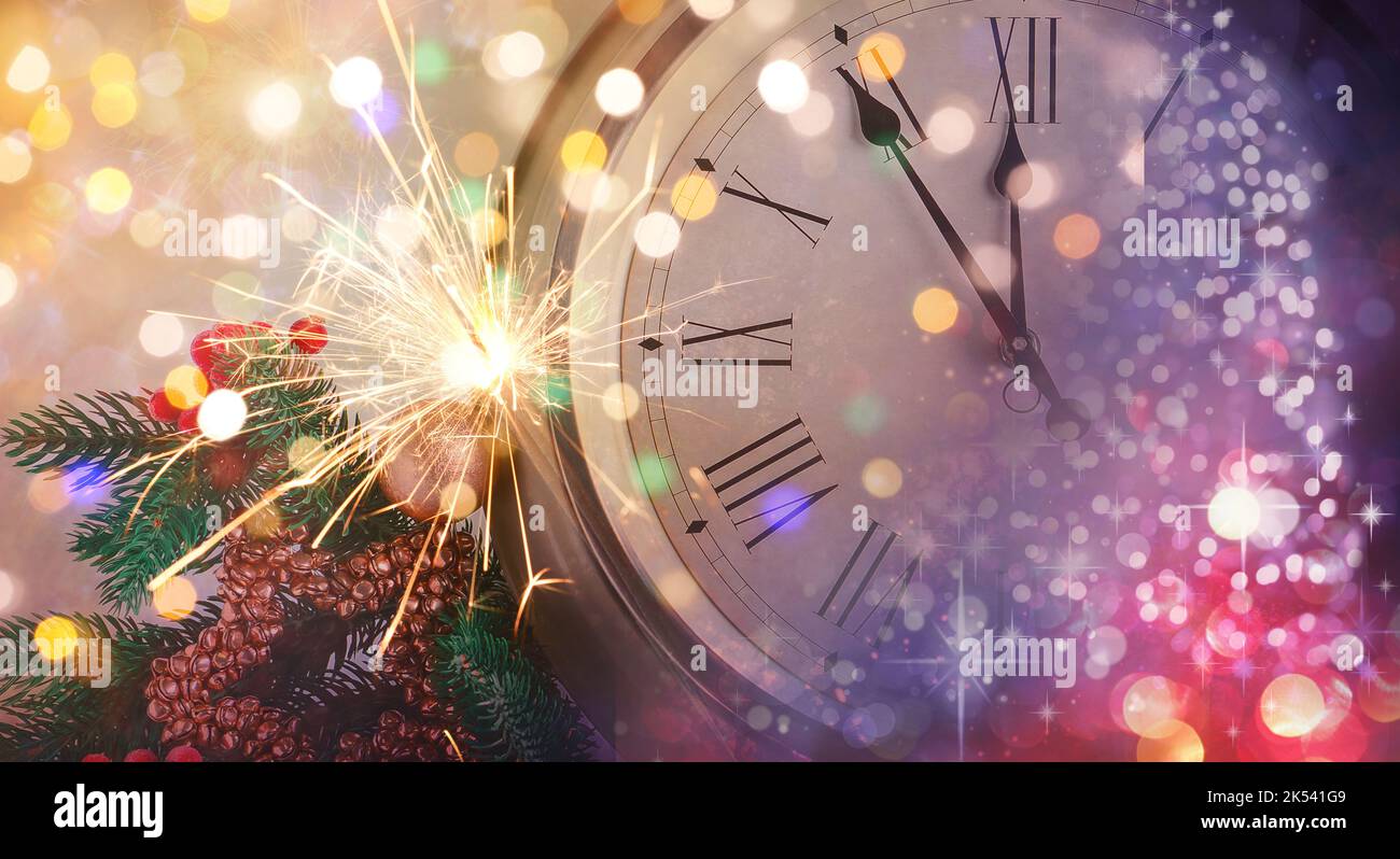 Festive collage of clock, Christmas sparkler and blurred lights. New ...
