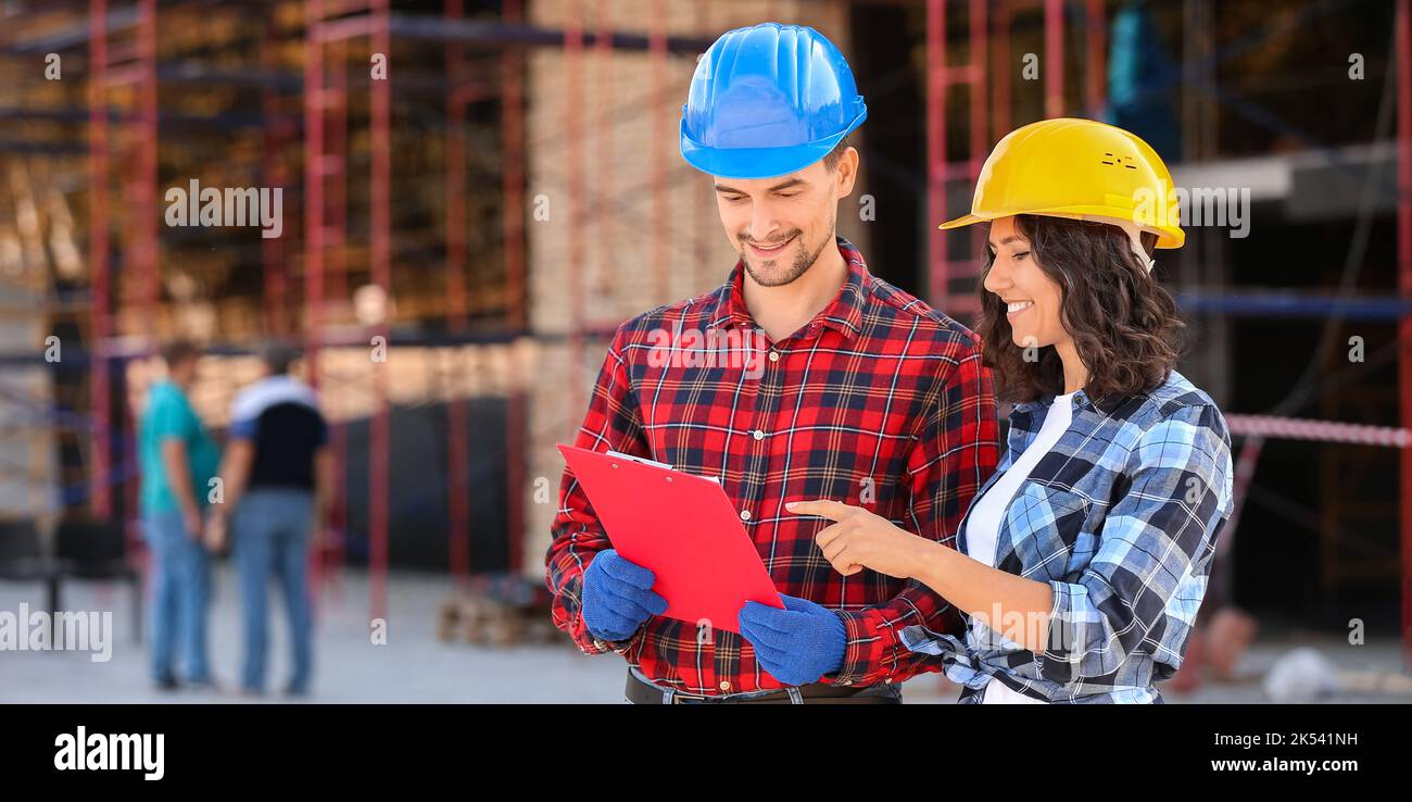 Architects discussing project of building at construction site Stock ...