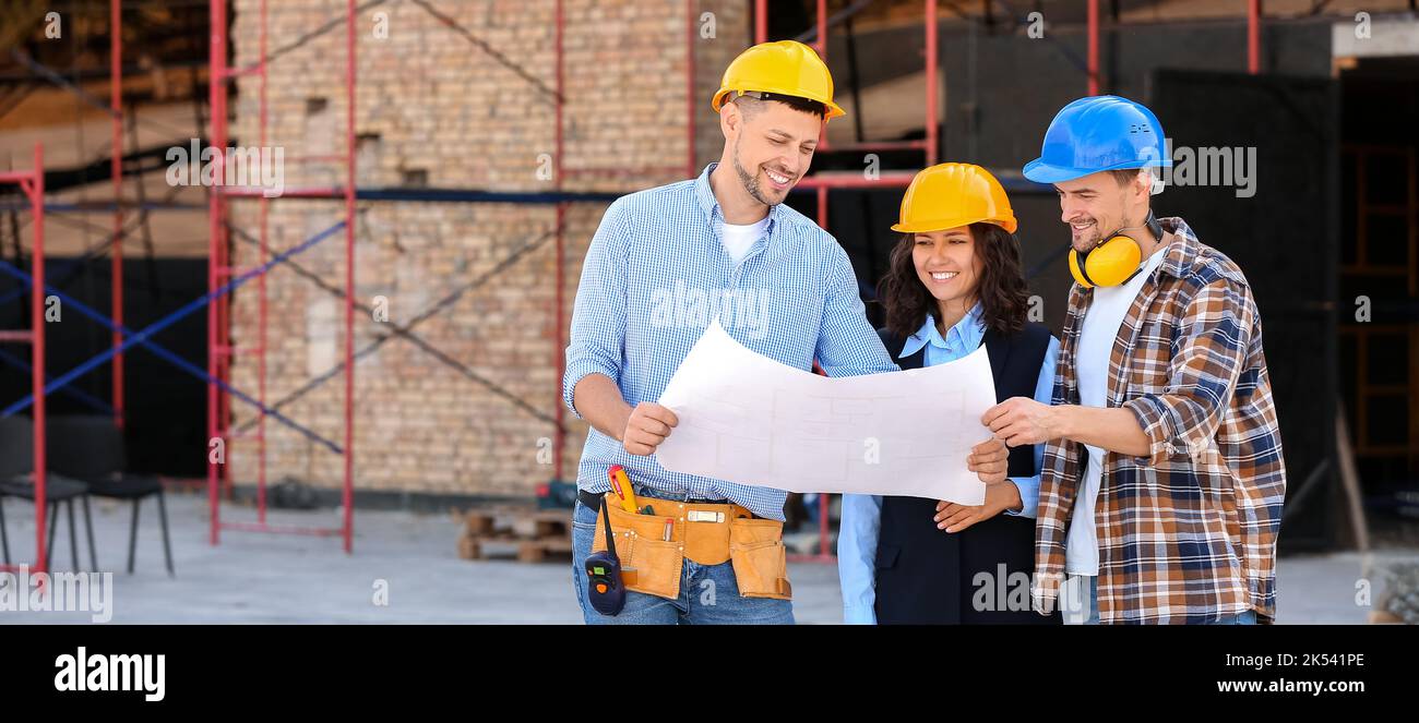 Architects discussing project of building at construction site Stock ...