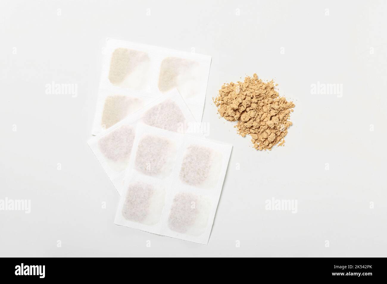 Mustard plasters and powder on white background Stock Photo - Alamy