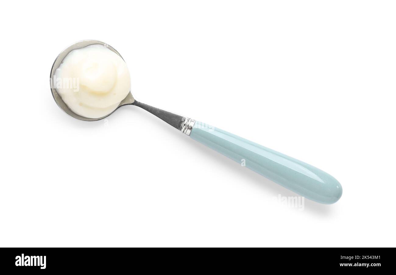 Spoon of delicious vanilla pudding on white background Stock Photo - Alamy