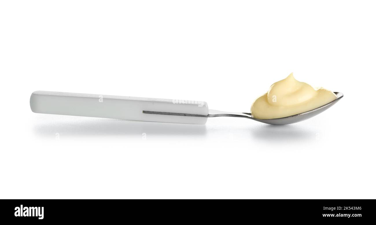 Spoon of tasty vanilla pudding on white background Stock Photo - Alamy