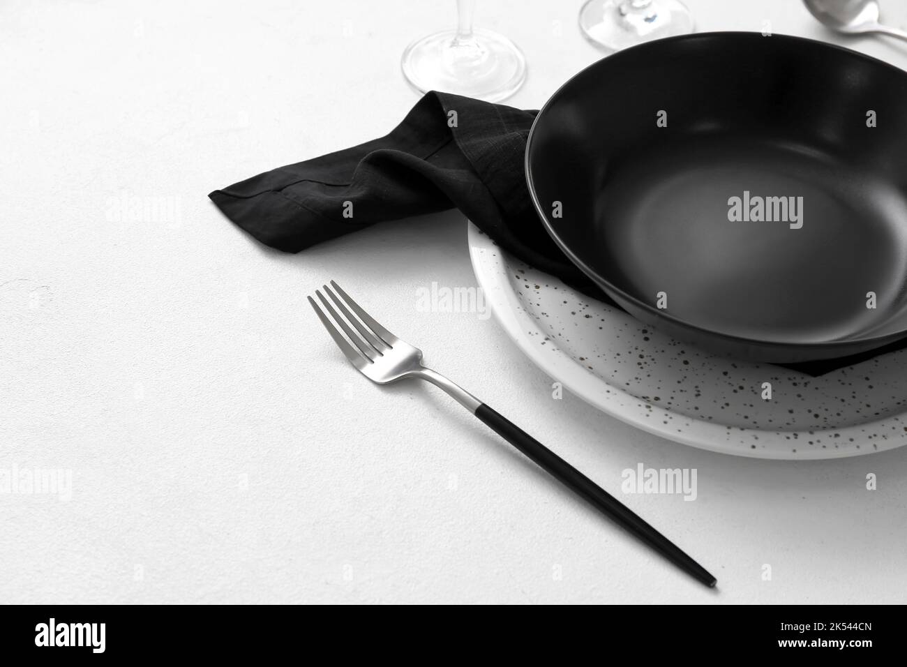 Stylish elegant table setting on light background Stock Photo - Alamy